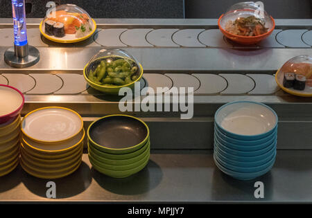 Sushi dishes on conveyor belt at Satori Sushi restaurant in Bentalls ...