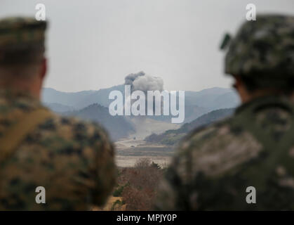 A mine clearing line charge (MCLIC) fired by U.S. Marine Corps M1 ...