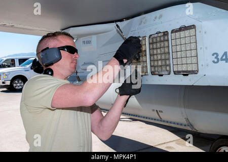 Senior Airman Kevin Isaac, aircraft armament systems specialist, loads ...