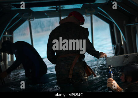 U.S. Marines enter the Modular Amphibious Egress Trainer during ...
