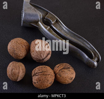 Greek nuts whole and split and the Nutcracker Stock Photo - Alamy