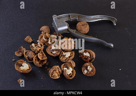 Greek nuts whole and split and the Nutcracker Stock Photo - Alamy
