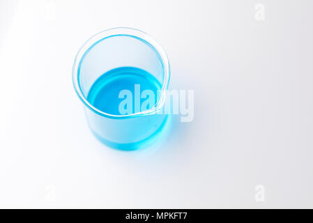 Glass beaker of copper sulfate solution (copper chloride) blue liquid ...