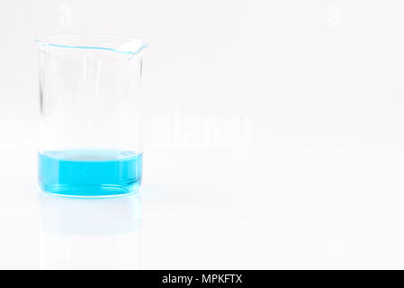 Glass beaker of copper sulfate solution (copper chloride) blue liquid ...