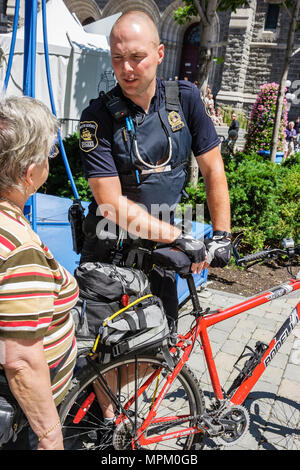 Senior woman with city bike using cell phone Stock Photo - Alamy