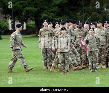 COL David C. Foley, 1-2 Stryker Brigade commander (center) waits with ...