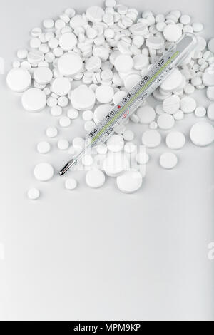 Bunch of white tablets. Scattered pills. Selective focus Stock Photo ...