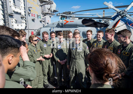 ATLANTIC OCEAN (April 1, 2017) Capt. Marc Miguez, center, commander ...