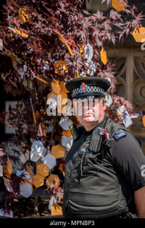 Greater Manchester Police officers look over the fans arriving at Old ...