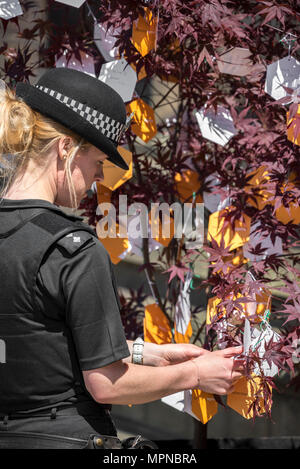 Greater Manchester Police officers look over the fans arriving at Old ...