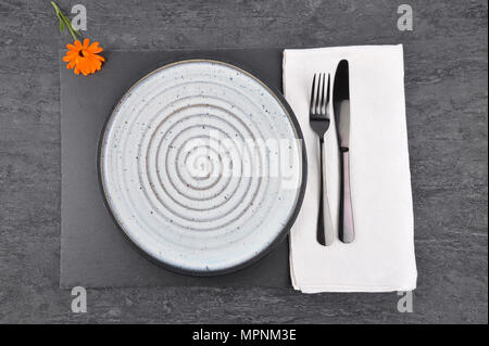 Common marigold and table setting on slate Stock Photo - Alamy