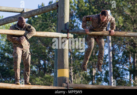 U.S. Army Rangers maneuver through the Malvesti Obstacle Course during ...