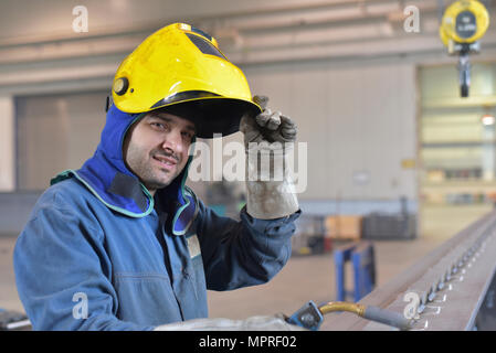 Portrait of confident welder in factory workshop Stock Photo - Alamy