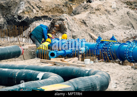 Workers laid water system pipeline at construction site. City ...