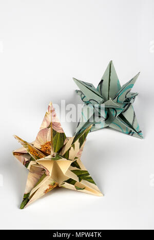 two paper origami on white background Stock Photo - Alamy