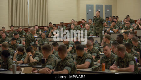 U.S. Marines with The Basic School (TBS) take off from the start line ...