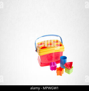 Plastic shape sorter cube isolated on white Stock Photo - Alamy