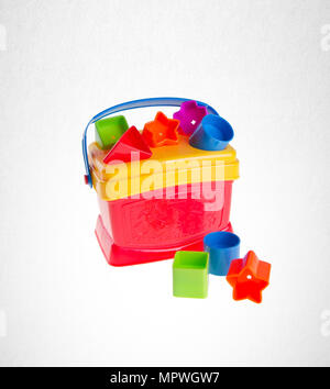 Plastic shape sorter cube isolated on white Stock Photo - Alamy