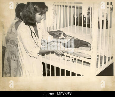 Philippines - Health - Woman cleaning baby Stock Photo - Alamy