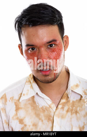 Halloween man portrait with head injury. Guy with dripping blood on his ...