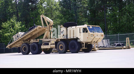 Army trucks with the Load Handling System Compatible Water Tank Rack ...