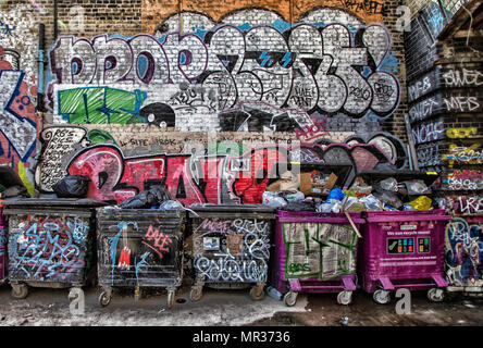 Graffiti street art on waste bins near Brick Lane in East London Stock ...