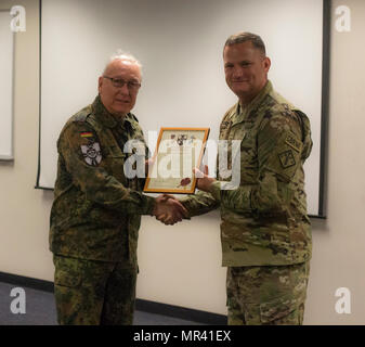 Commander of the 48th Chemical Brigade, Col W.M. Bochat, receives a ...