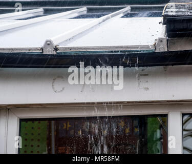 Heavy rainfall overflowing roof gutter and not going down the downspout ...