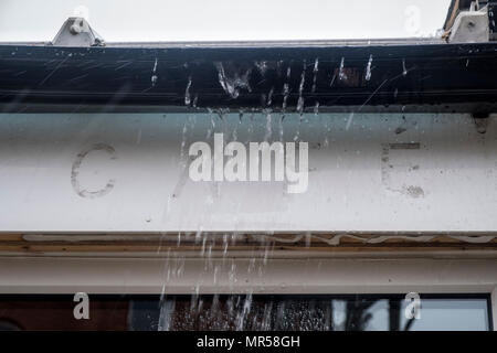 Guttering overflowing during heavy rainfall - UK Stock Photo - Alamy
