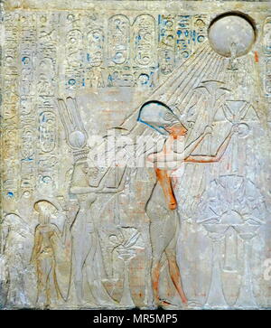 stele representing Akhenaton, worshiping the Aten sun disk. King ...