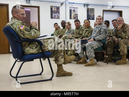 Commander of the 48th Chemical Brigade, Col W.M. Bochat, receives a ...