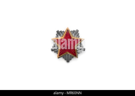 Old red star from communist military cap isolated on the white ...