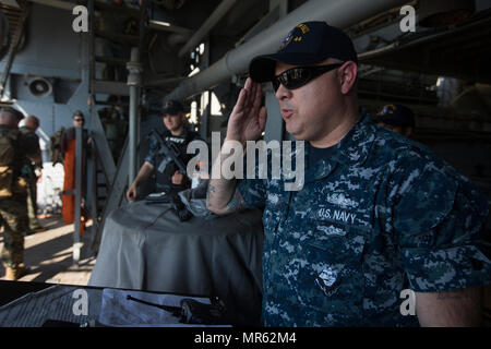 U.S. Navy IT1 Matthew Favila, an information systems technician ...