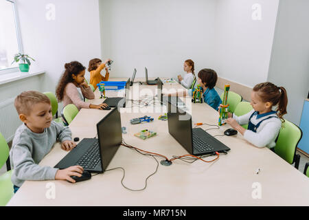 Group of focused kids working at class Stock Photo - Alamy