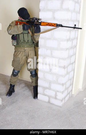 insurgent sniper with SVD rifle inside the building Stock Photo - Alamy