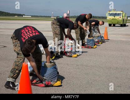 Aircraft Rescue and Firefighting Marines assemble around the Mobile ...