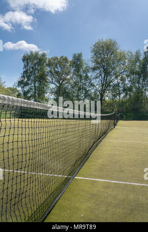 Tennis court with green grass and net outdoors Stock Photo - Alamy
