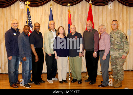 Division Command Sergeant Major Todd Sims congratulates and gives a ...