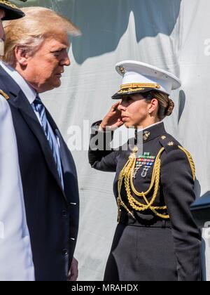 President Donald Trump, right, salutes Air Force Col. Angela F. Ochoa ...