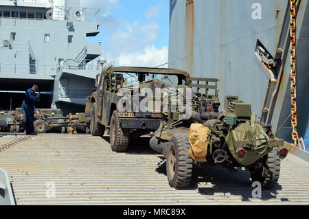 A humvee towing a M777A2 155mm howitzer, assigned to 3rd Battalion, 7th ...