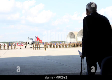 Retired Col. Thomas Murphree stands to honor the National Anthem during ...