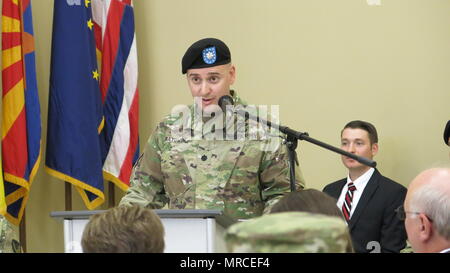 Lt. Col. Jeffrey Ignatowski, center, receives the Letterkenny Munitions ...