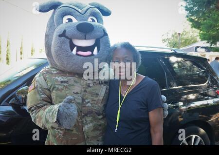 Rocky, the 3rd Infantry Division mascot, poses with a statue of himself ...