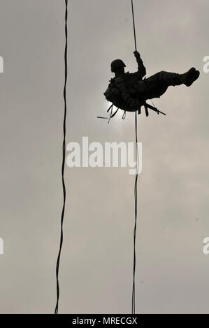 A Soldier rappels from a 70-foot tower during the final phase of Air ...