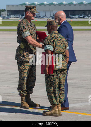 Col. Christopher Ward receives the colors from Brenda Lee McCullough ...