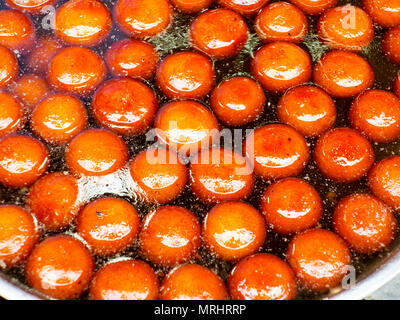 Gulab Jamun being made at a restaurant, this is a traditional indian ...