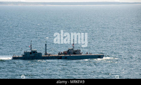 Improved Navy Lighterage System (INLS) Warping Tug 11 hip tows the INLS ...