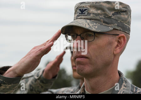 Col. Greg Buckner, 90th Maintenance Group commander, passes the guidon ...