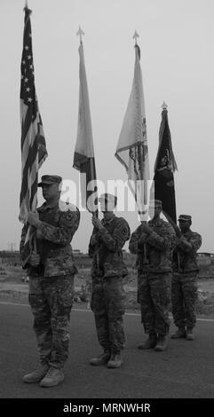 From left to right, Spc. Colton Sherrill carrying the American Flag ...