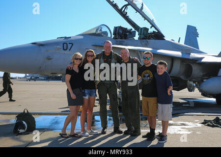 Col. William Swan poses for a photo with his family and Maj. Gen. Mark ...